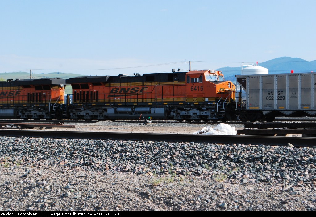 BNSF 6415 and BNSF 6409 roll east as rear DPU's behind the leader BNSF 5982.